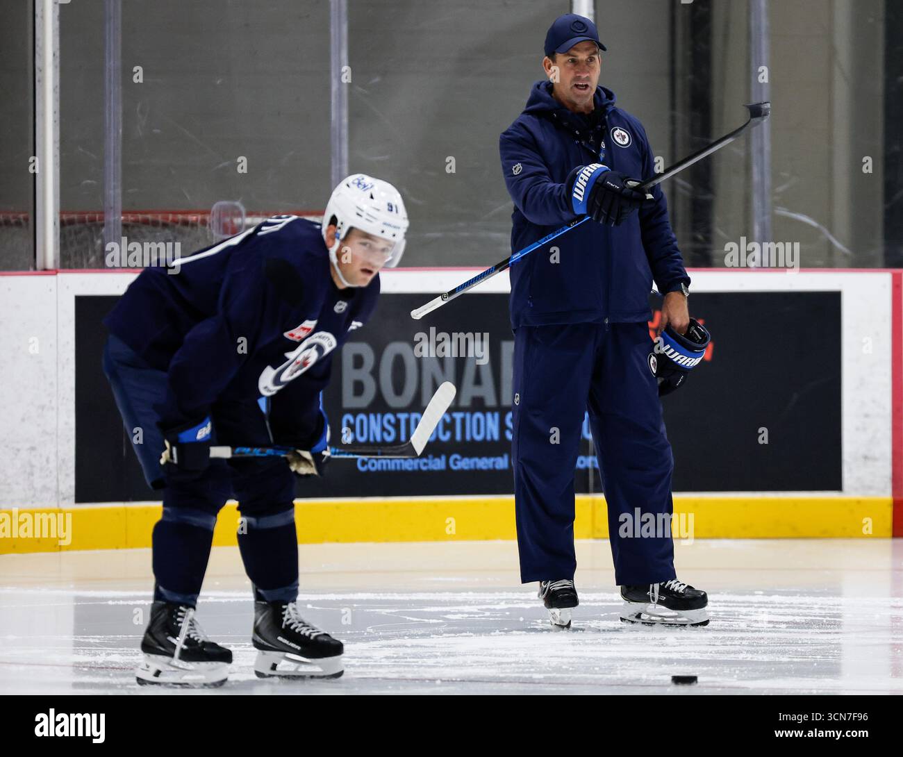 Winnipeg Jets' Cole Perfetti (91) listens in as head coach Scott Arniel ...
