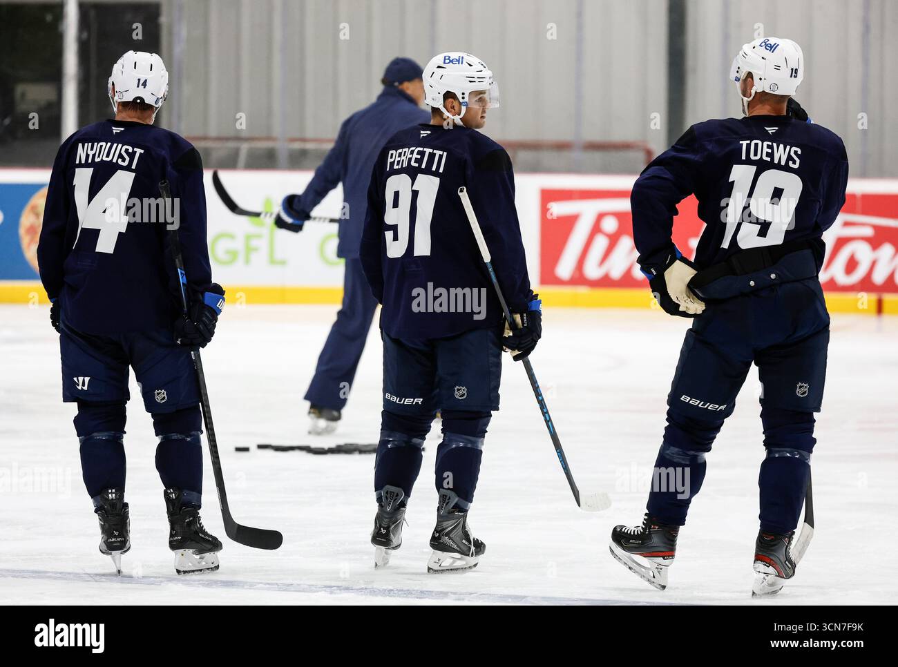 Winnipeg Jets' Gustav Nyquist (14). Cole Perfetti (91) and Jonathan ...