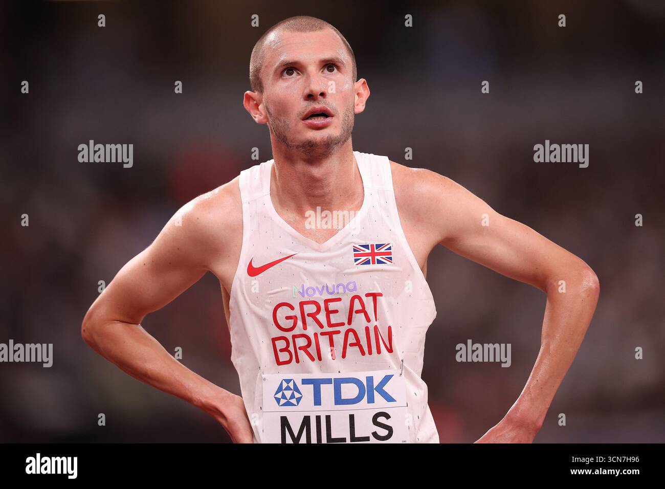 George Mills of Great Britain checks his time after competimg in the ...
