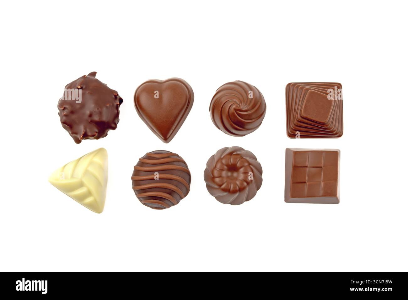 A row of chocolate candies with different shapes and sizes. The candies ...