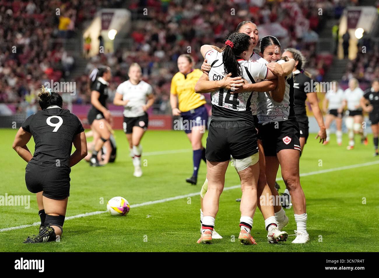 Canada's Florence Symonds (second right) celebrates scoring a try with ...
