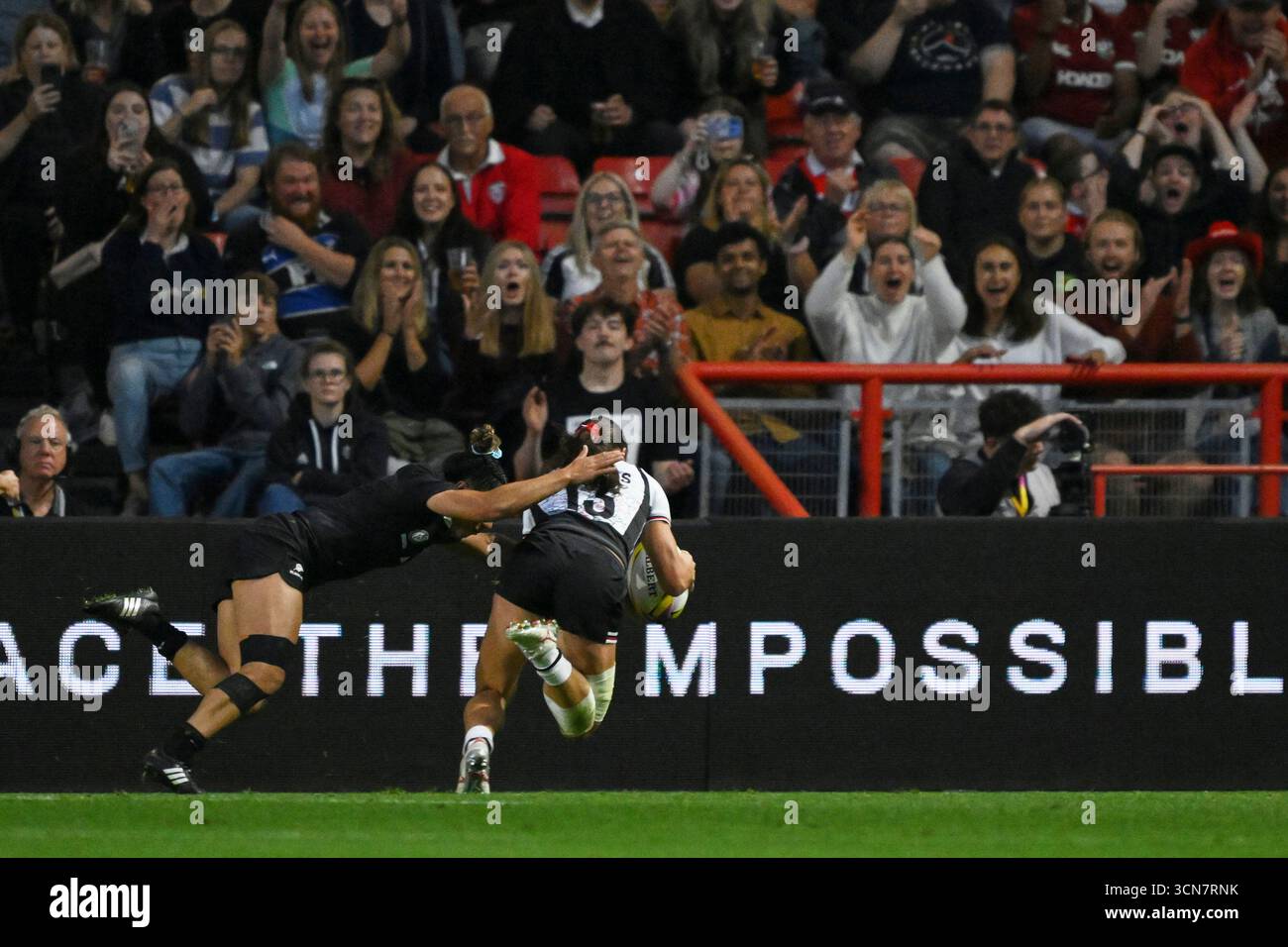 Canada's Florence Symonds, right, scores a try during the Women's Rugby ...