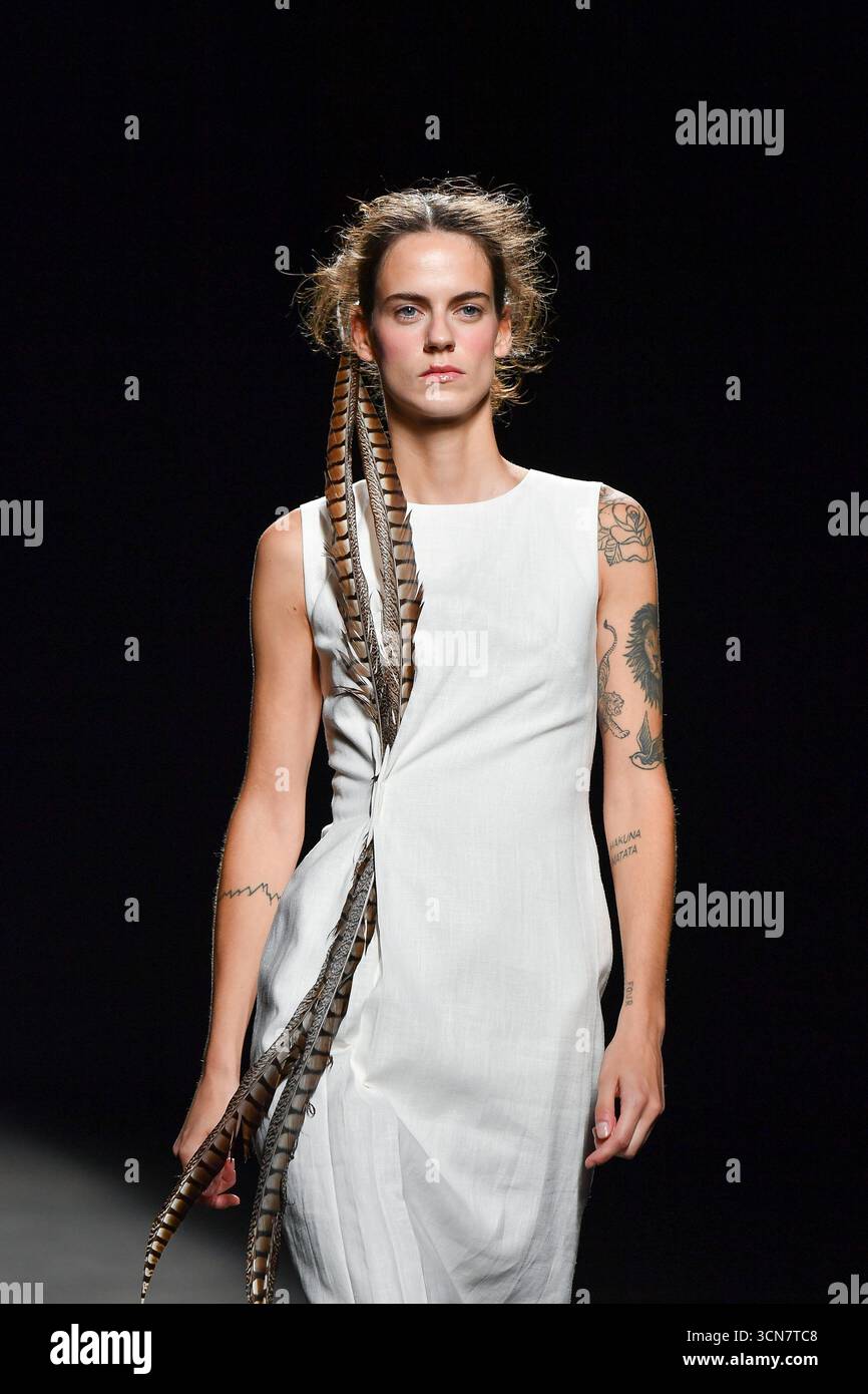 A model walks the runway wearing a design by Baro Lucas during the ...