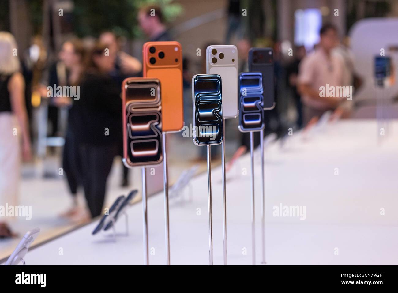 Apple CEO Tim Cook welcomes the first iPhone 17 customers in New York ...