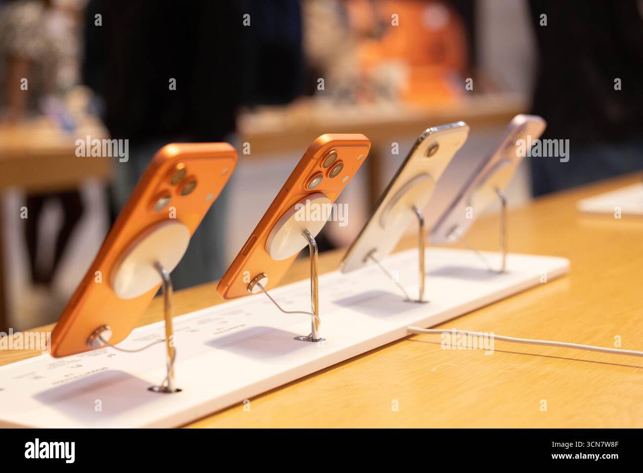 Apple CEO Tim Cook welcomes the first iPhone 17 customers in New York ...