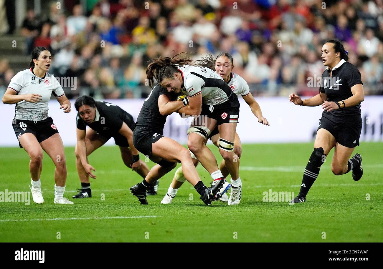 Canada's Caroline Crossley (centre right) is tackled by New Zealand's ...