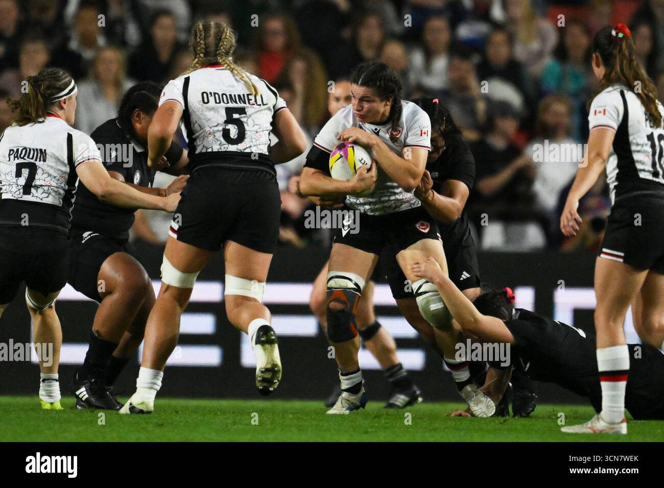 Canada's Fabiola Forteza, centre, challenges for the ball during the ...