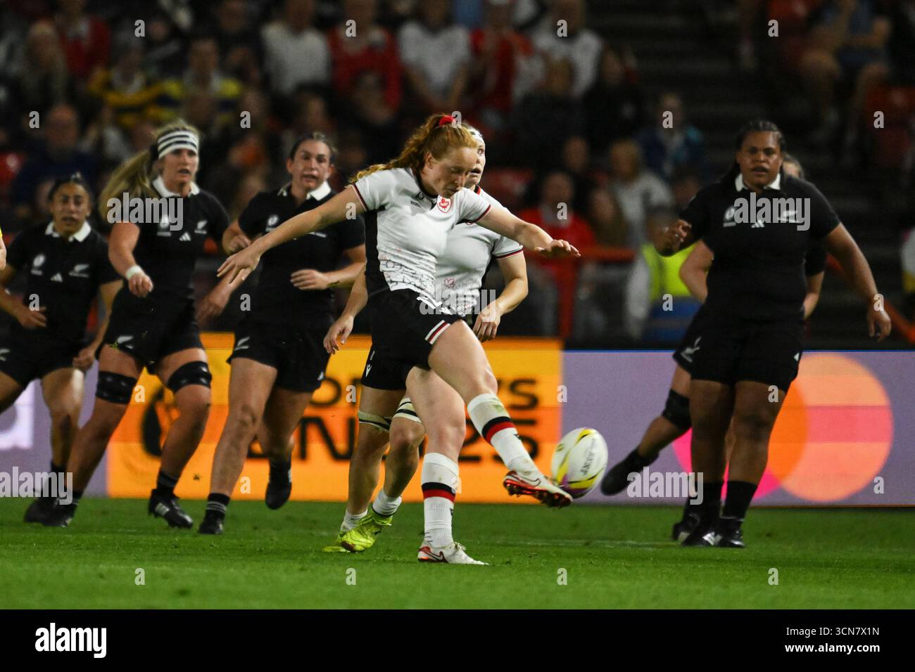 Canada's Alex Tessier kicks the ball during the Women's Rugby World Cup ...