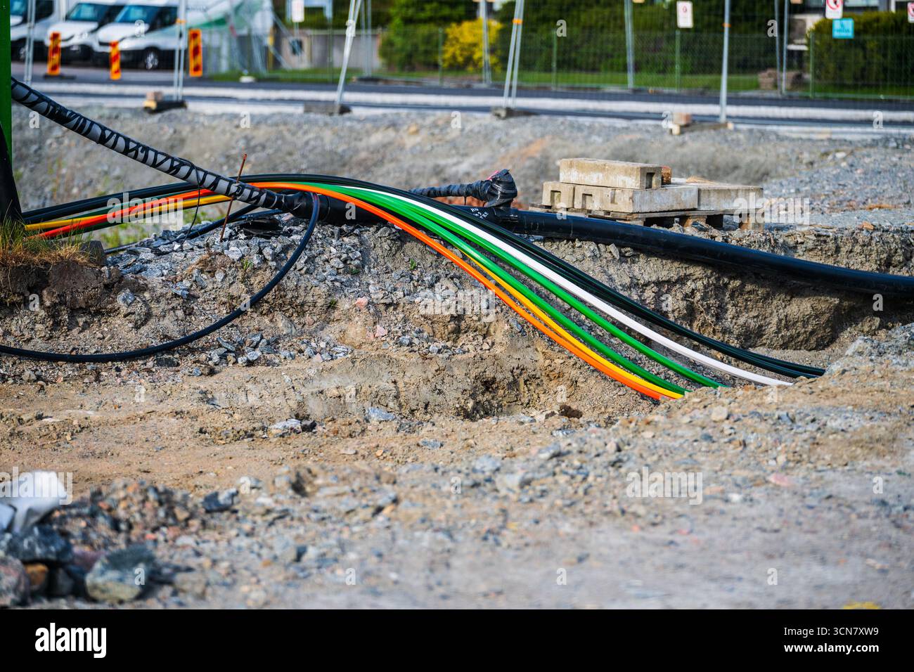 Colorful underground cables at construction site Stock Photo - Alamy