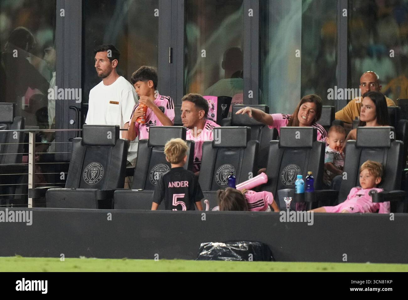 Inter Miami forward Lionel Messi, left watches from a filed level suite ...