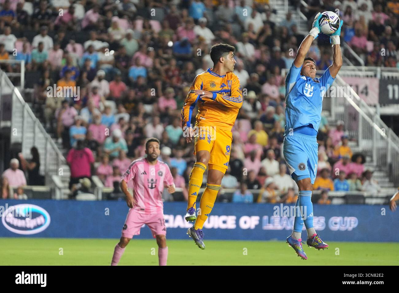 Inter Miami goalkeeper Óscar Ustari, right, makes a save as Tigres UANL ...
