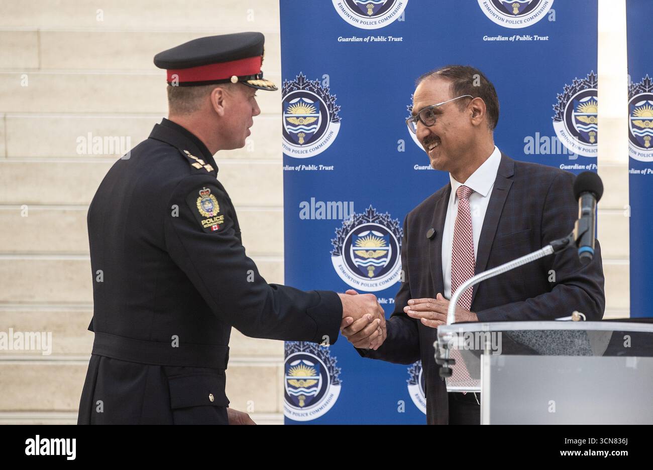 New Edmonton Chief of Police Warren Driechel is congratulated by Mayor ...