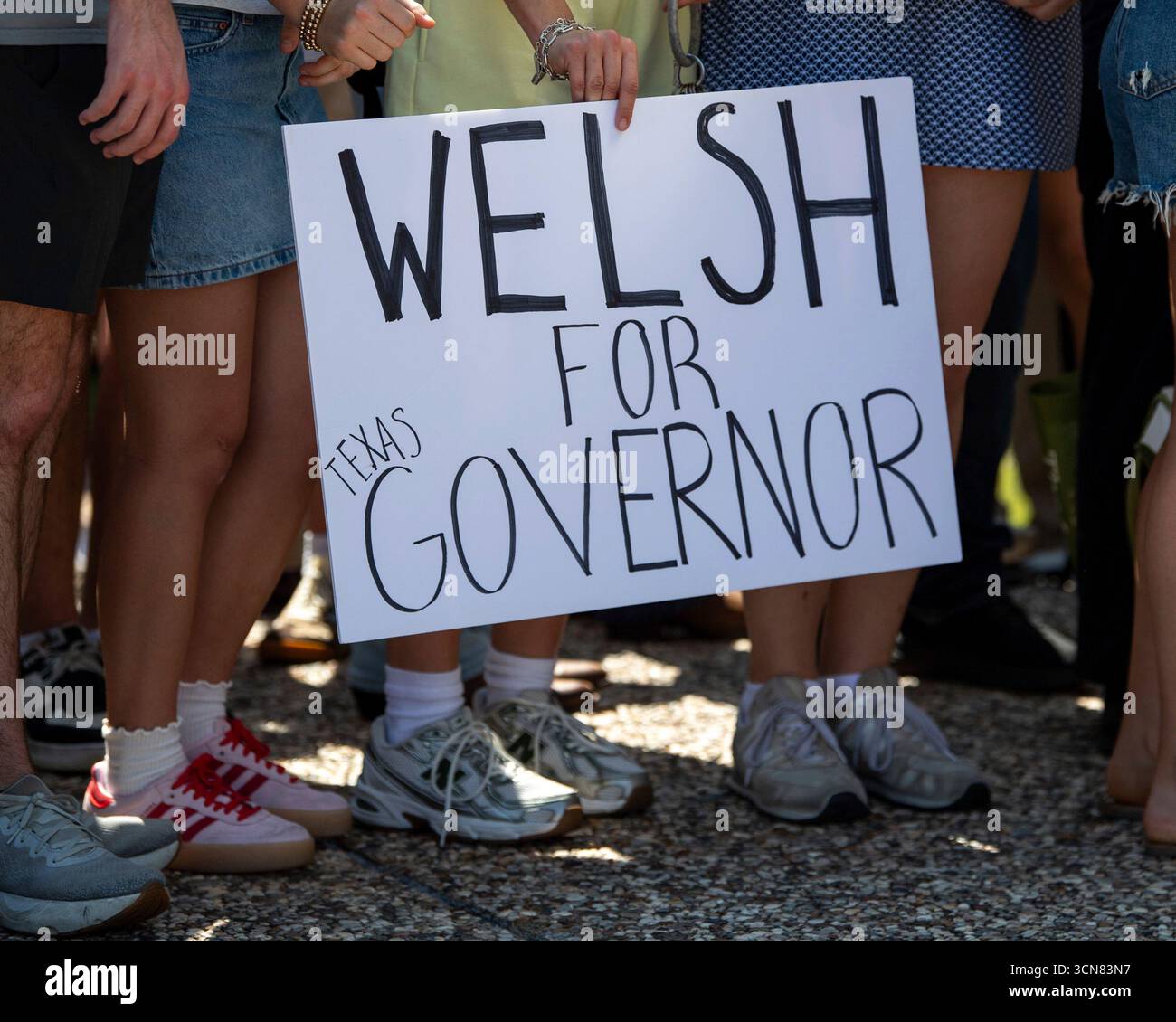 Supporters hold signs during a sendoff for Texas A&M University ...