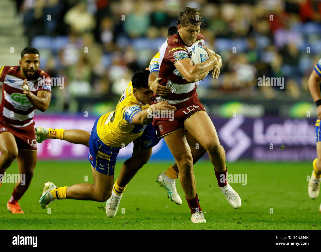 Wigan Warriors' Sam Walters is tackled during the Betfred Super League ...