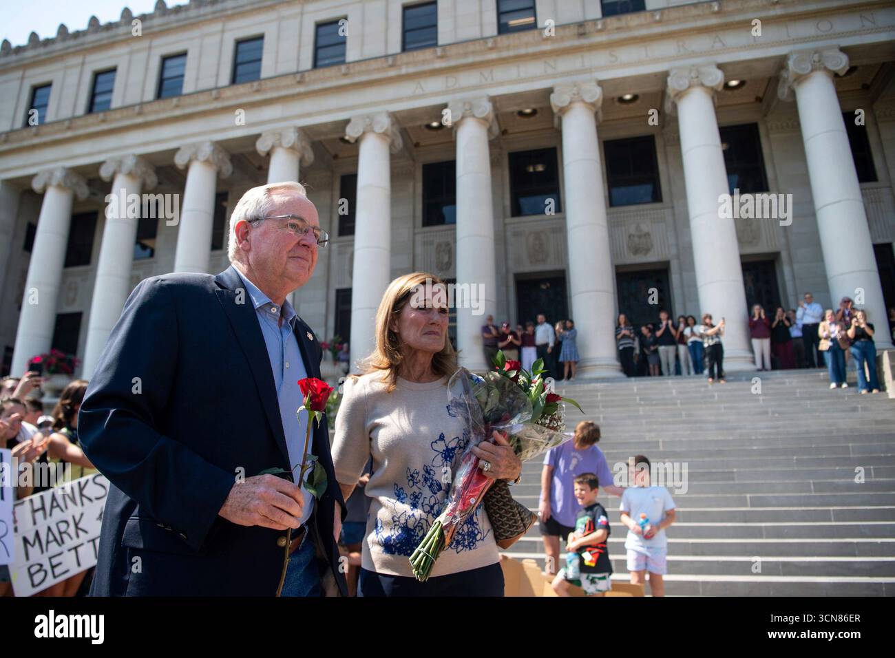 Texas A&M University President Mark Welsh and his wife, Betty Welsh, exit the Texas A&M ...