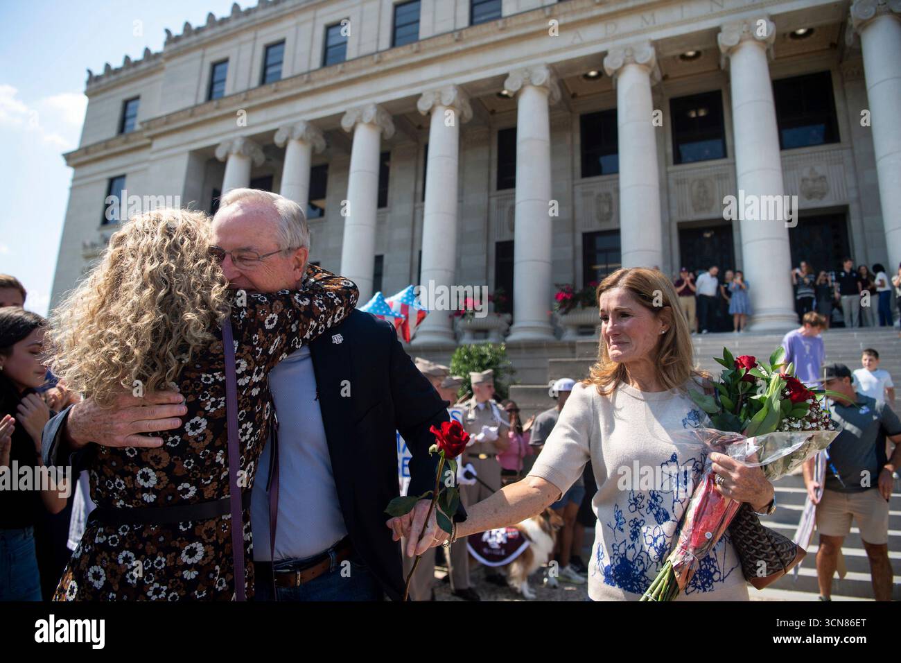 Texas A&M University President Mark Welsh, center, and his wife, Betty ...