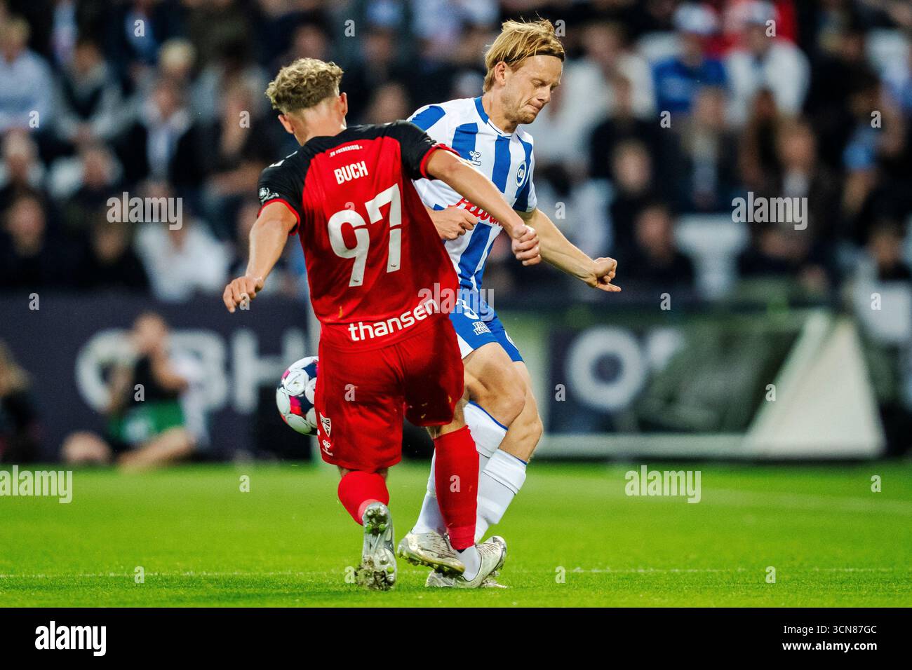 FC Fredericia's Oscar Buch and Odense Boldklub's Adam Soerensen during ...