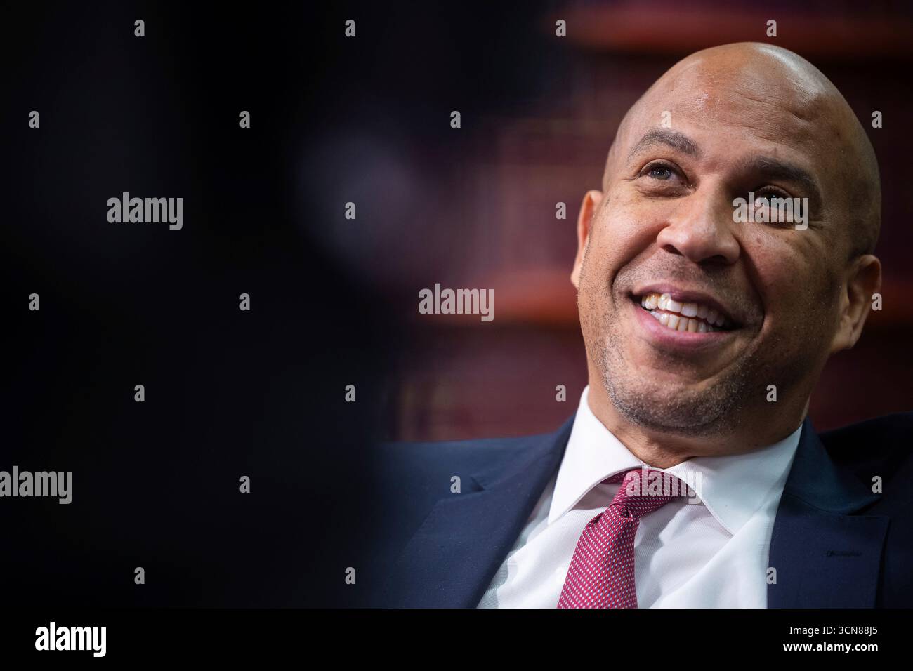 Sen. Cory Booker (D-N.J.) banters with reporters before a press ...