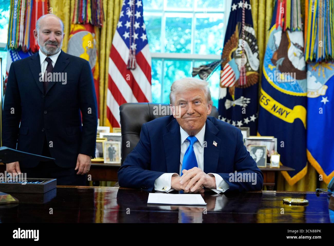 President Donald Trump, right, and Commerce Secretary Howard Lutnick ...