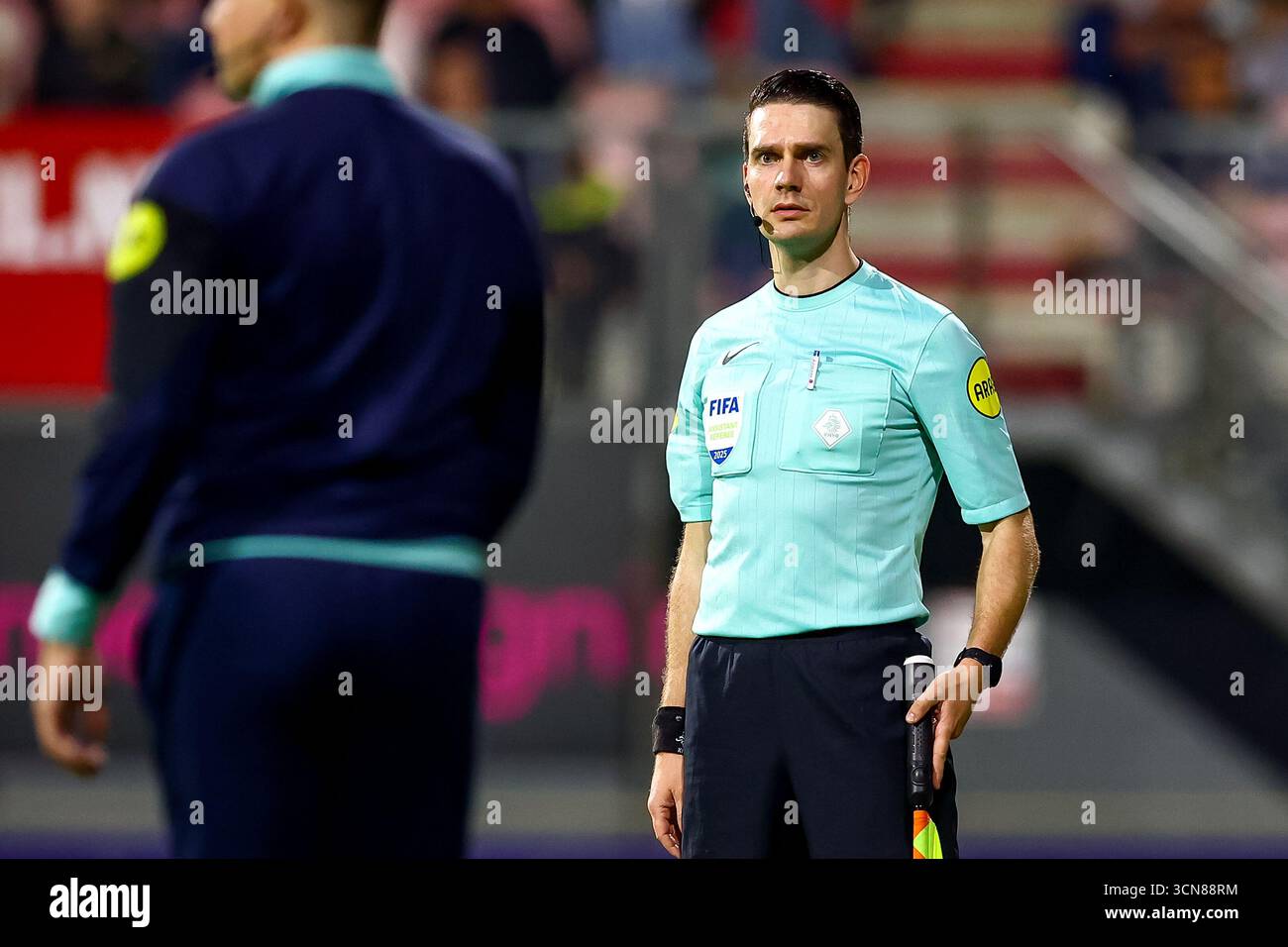 EMMEN, NETHERLANDS - SEPTEMBER 19: Assistant referee Dyon Fikkert looks ...