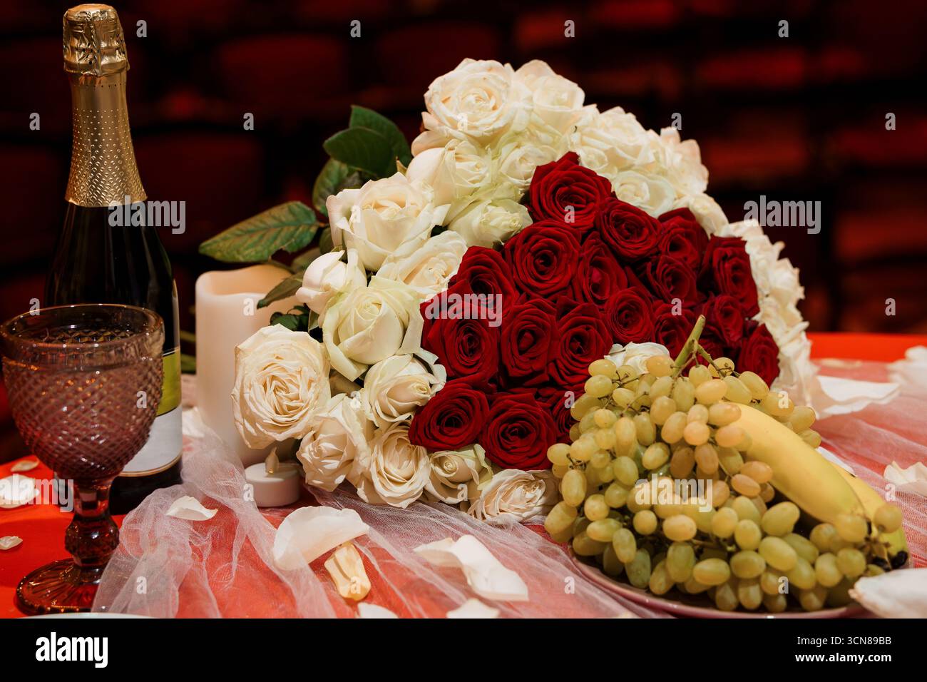 Romantic Celebration Still Life: Red Roses, Champagne, Grapes, Wine ...
