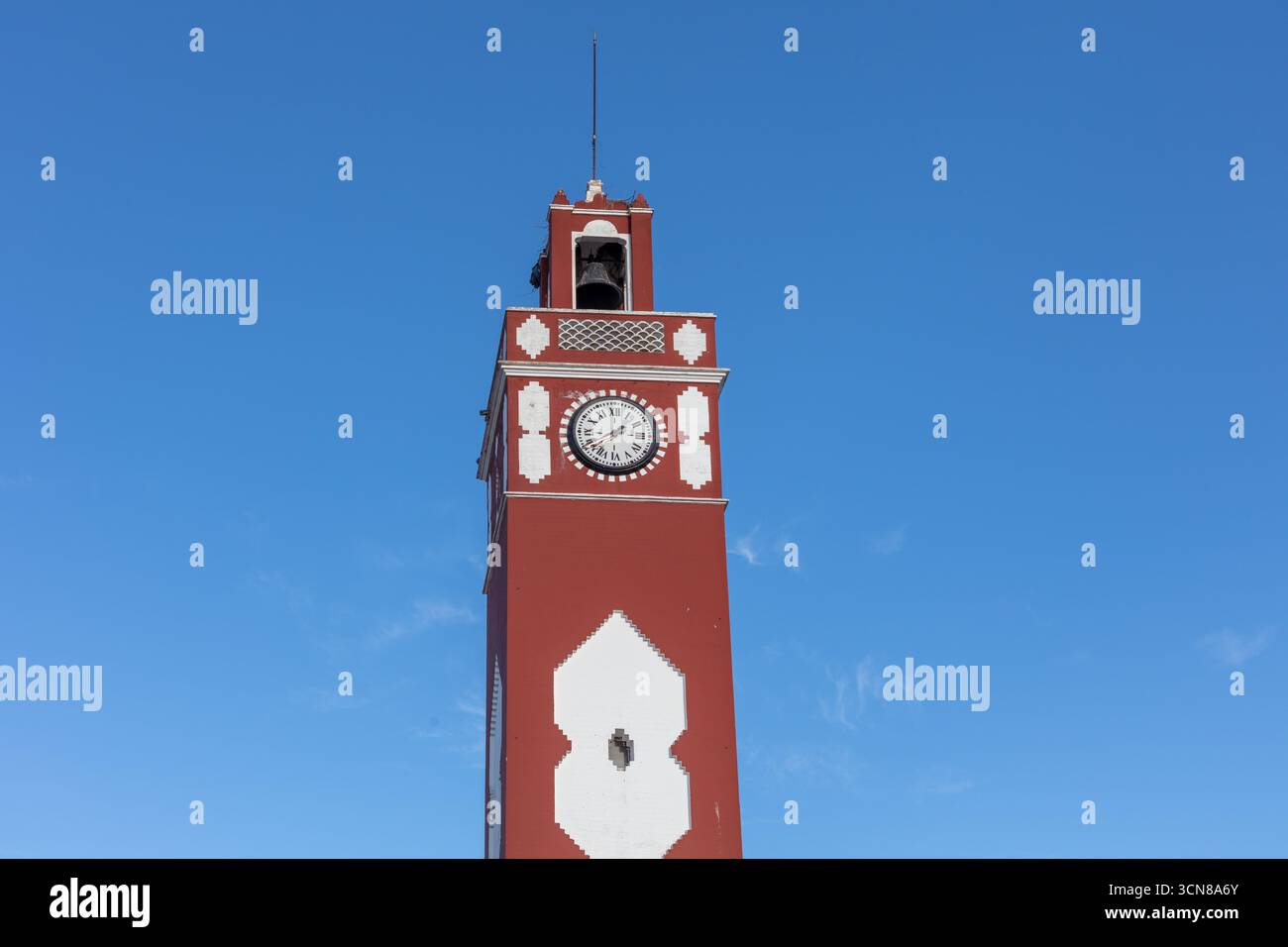 Marchena, Andalusia, Spain. 4 September 2025. Red and white clock tower ...