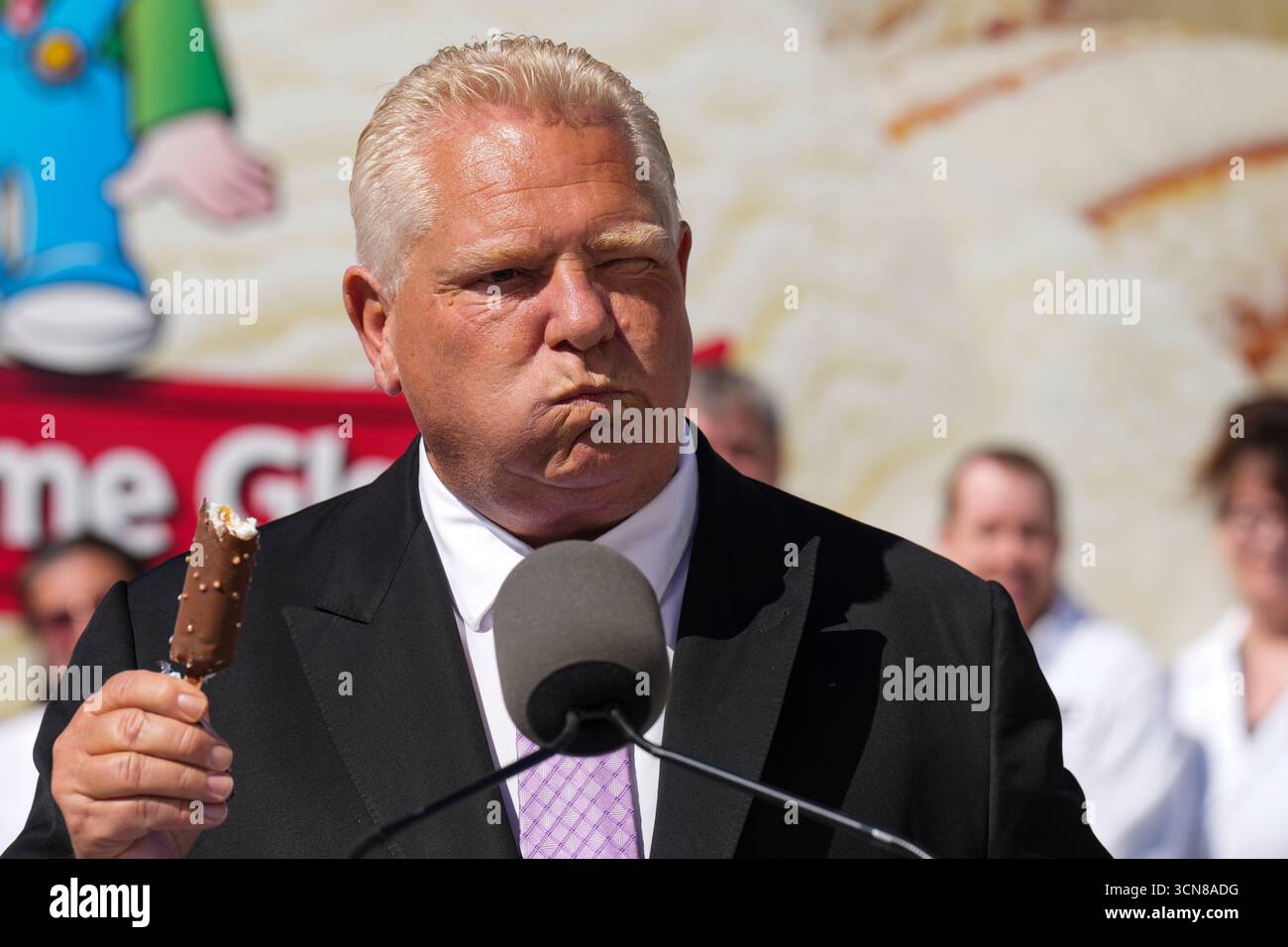 Ontario Premier Doug Ford eats an ice cream during an availability at ...