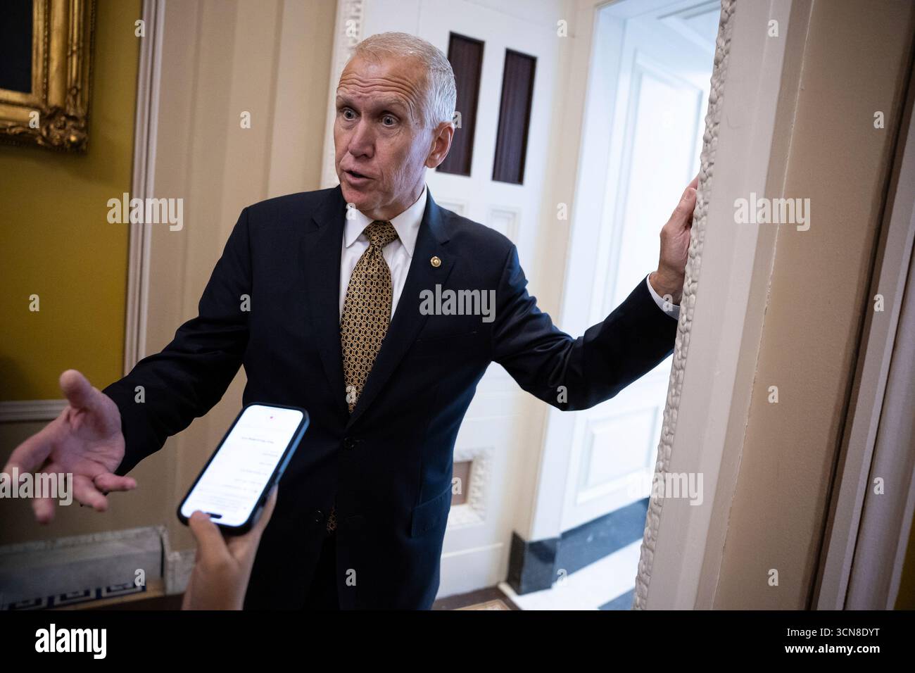 Sen. Thom Tillis (R-N.C.) speaks with reporters as the Senate prepared to vote on a continuing ...