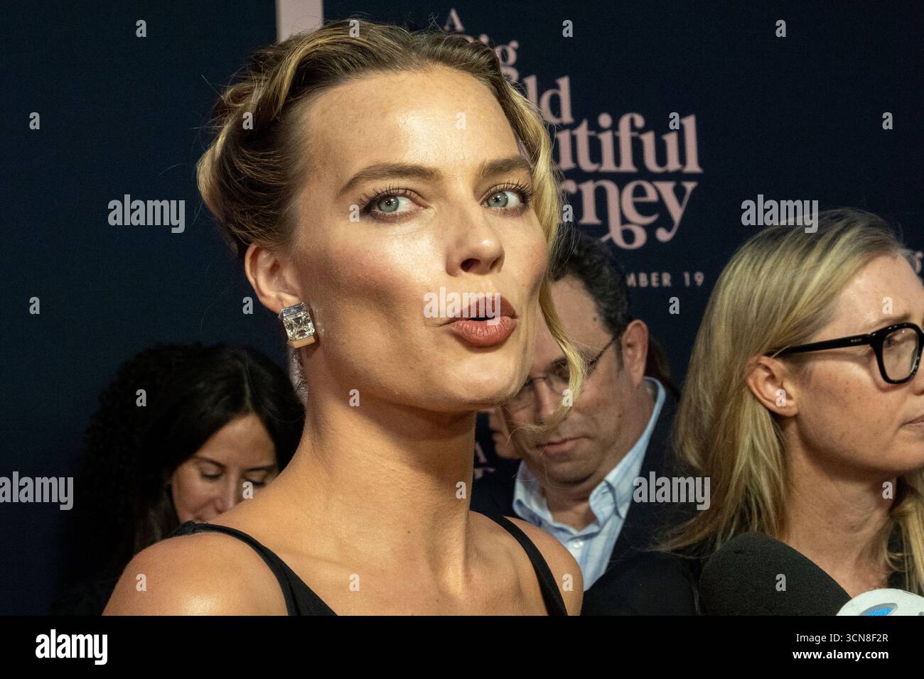 Margot Robbie speaks with the media at the Sony Pictures premiere of "A ...