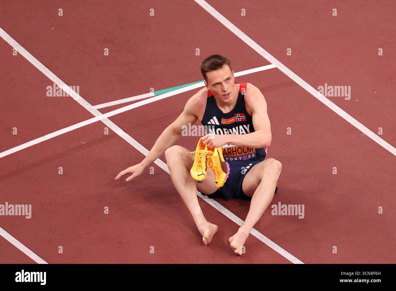 Norway's Karsten WARHOLM sits on the track after finishing fifth in the ...