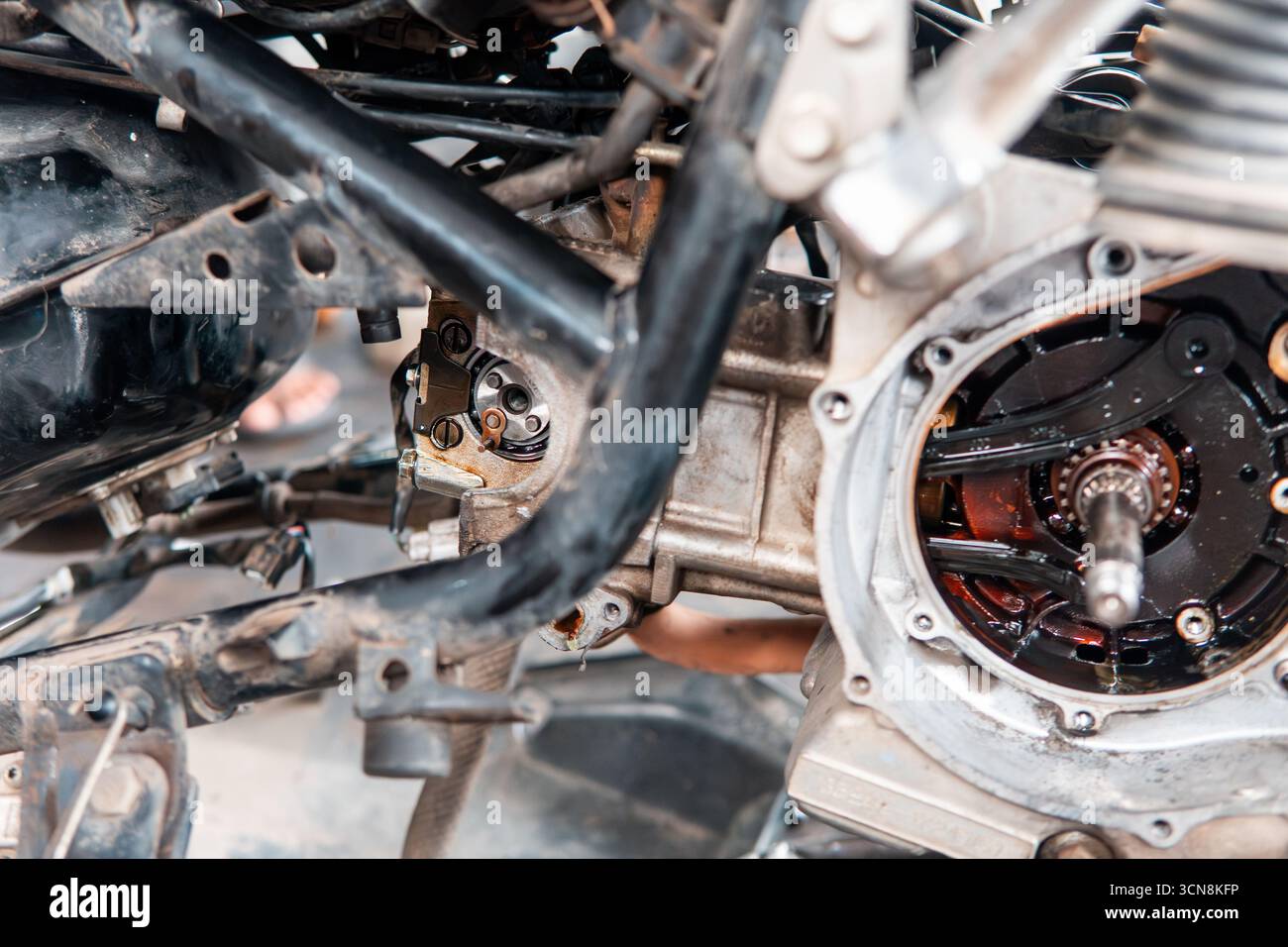 Close-up of a motorcycle engine crankcase and transmission parts ...