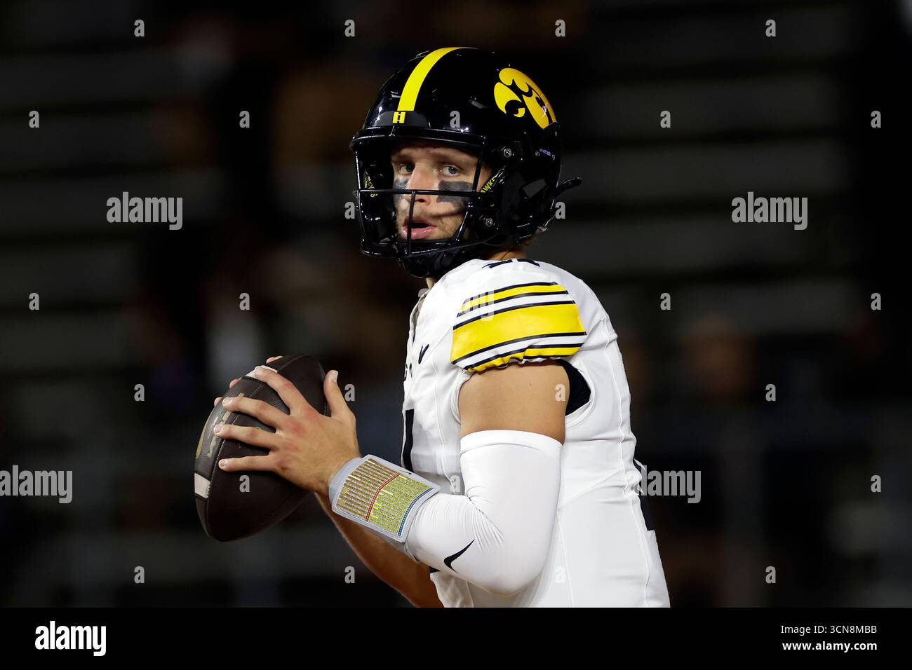 Iowa quarterback Mark Gronowski (11) warms up before an NCAA football ...