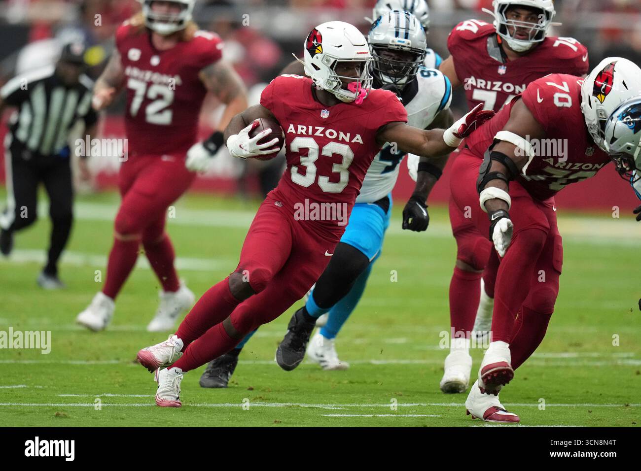 Arizona Cardinals running back Trey Benson (33) runs the ball against ...