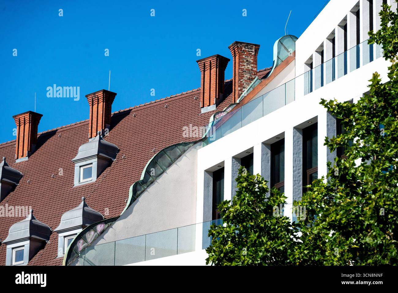 Architectural contrast in Berlin, Germany. A historic building with a ...