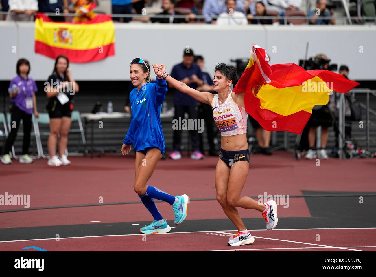 Spain's Maria Perez celebrates with Italy's Antonella Palmisano, left ...