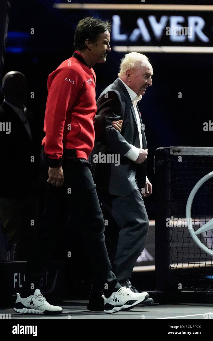 Team World vice captain Patrick Rafter, left, walks with Rod Laver ...