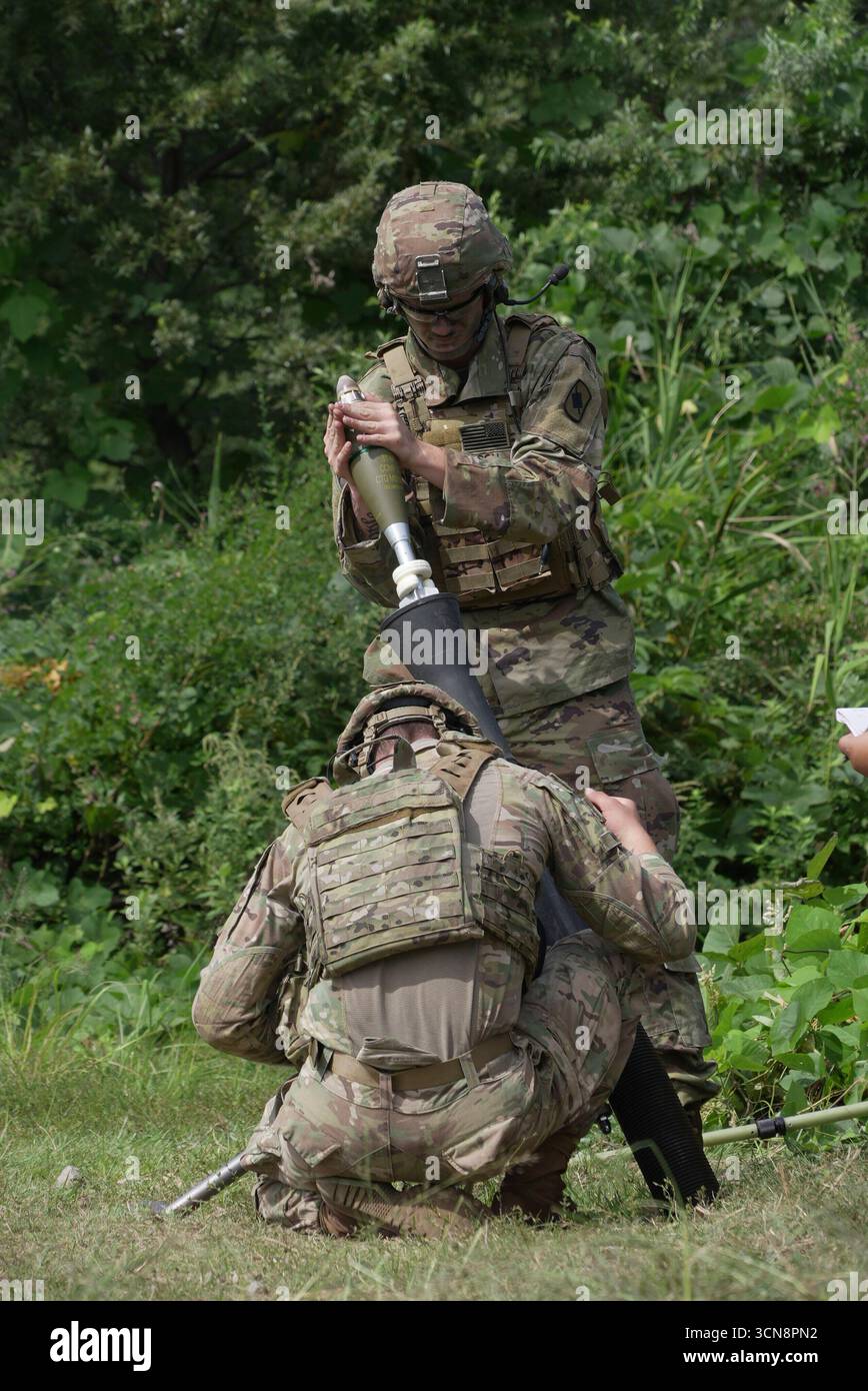 The US Army prepares to fire 81mm mortar during a joint military ...