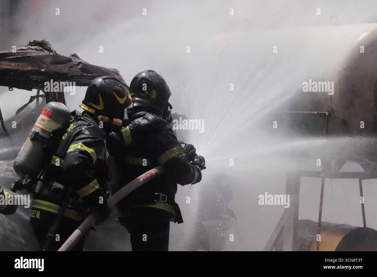 Firefighters extinguish a fire during the second national earthquake ...