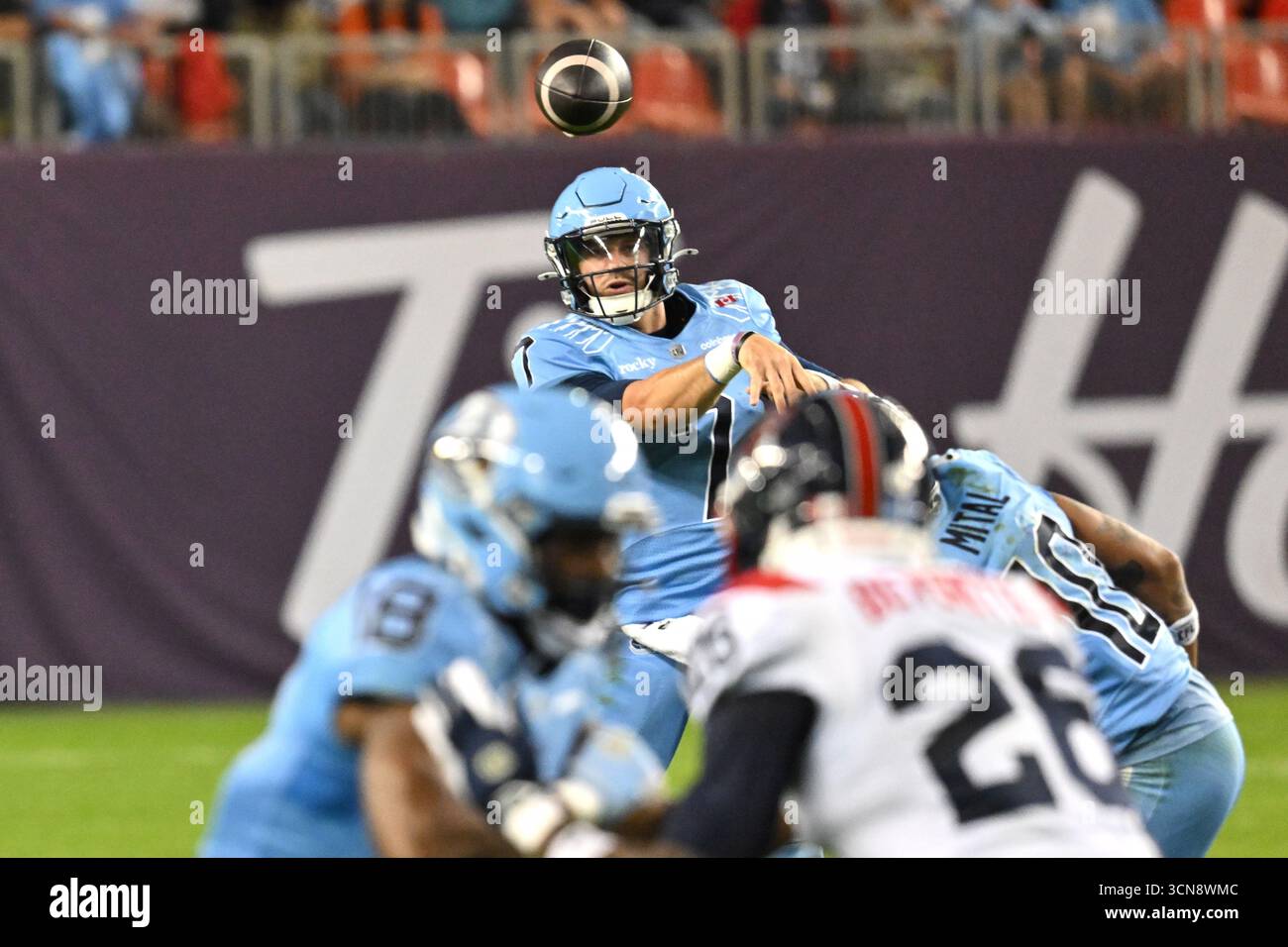 Toronto Argonauts quarterback Jarret Doege, top, throws downfield ...