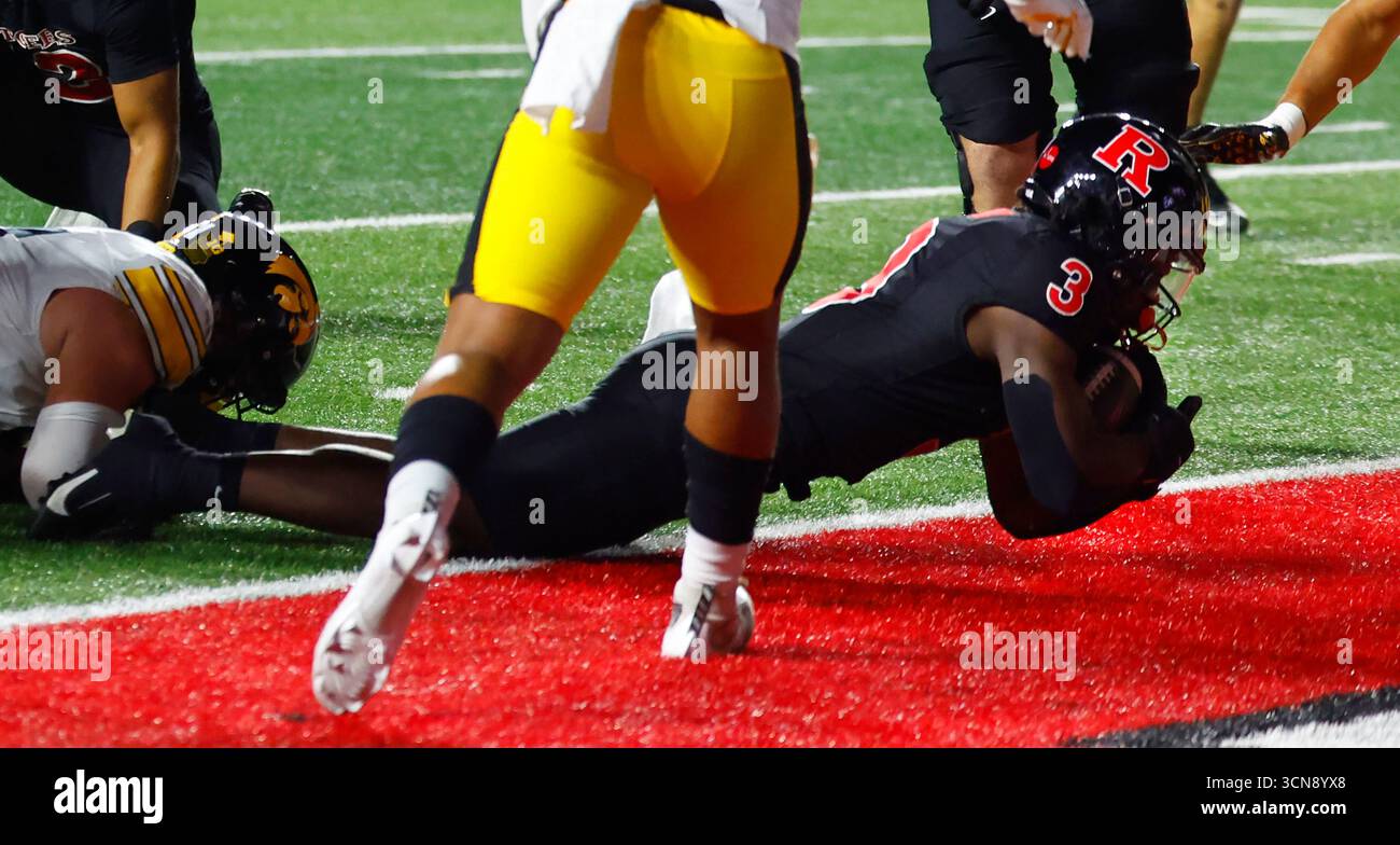 Rutgers running back Antwan Raymond (3) scores a touchdown against Iowa ...