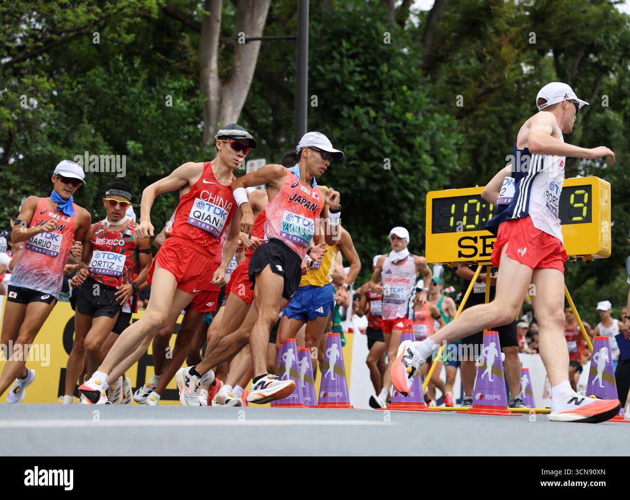 Athletes compete in the men's 20 kilometers race walk final at the ...