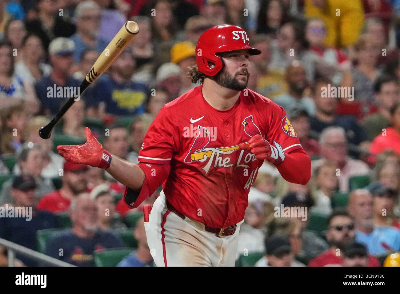 St. Louis Cardinals' Alec Burleson drops his bat after hitting a single ...