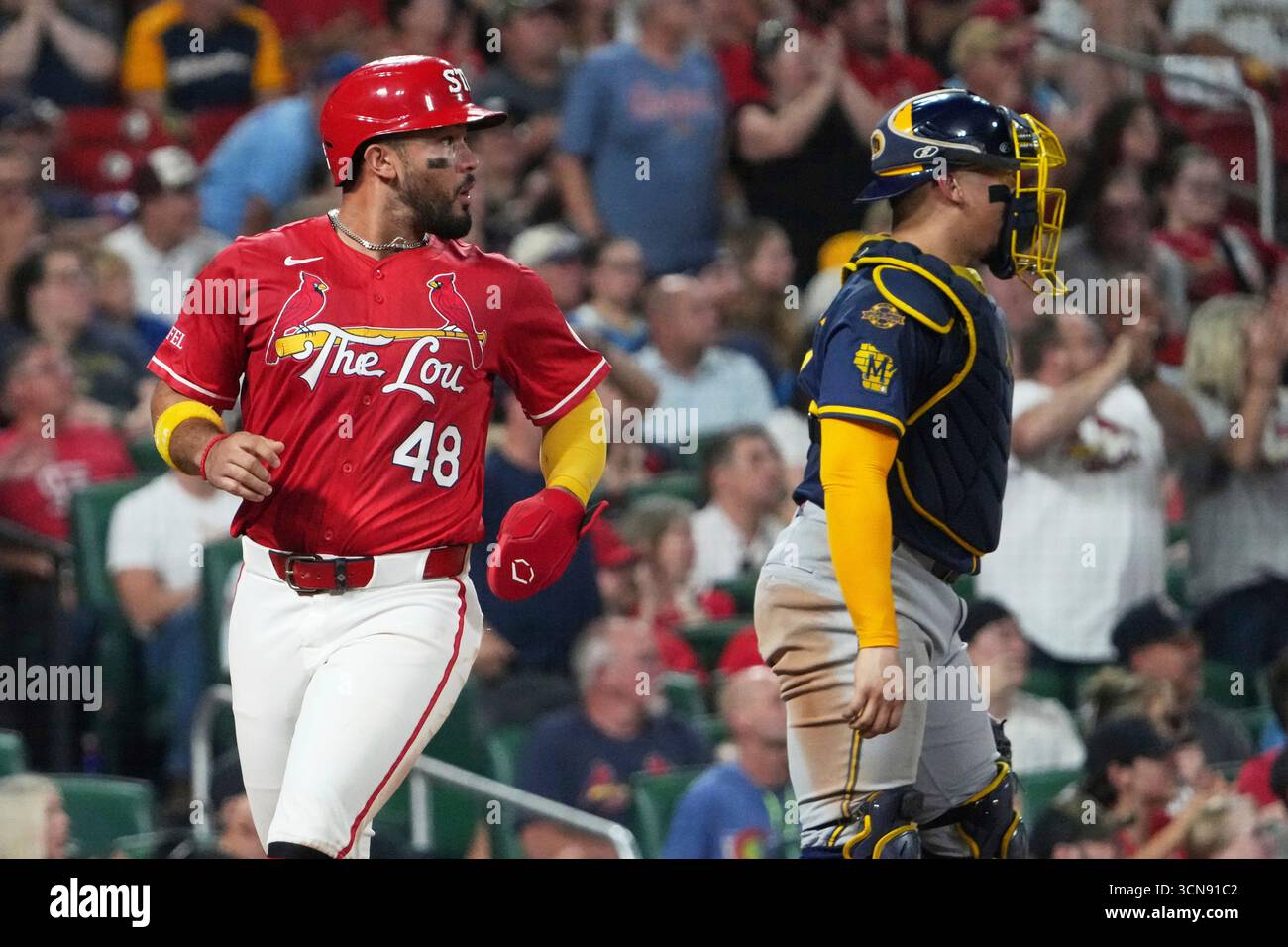 St. Louis Cardinals' Ivan Herrera (48) scores past Milwaukee Brewers ...
