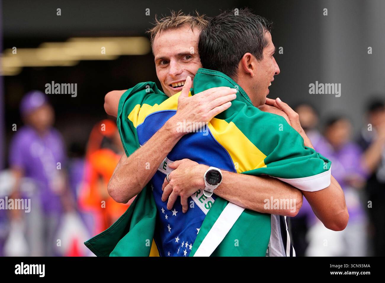 France's Aurelien Quinion, left, congratulates Brazil's Caio Bonfim ...