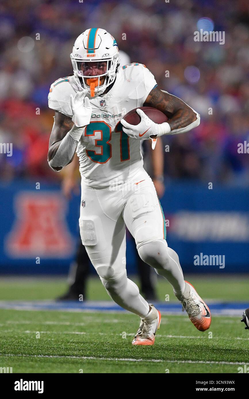 Miami Dolphins running back Ollie Gordon II (31) runs with the ball ...