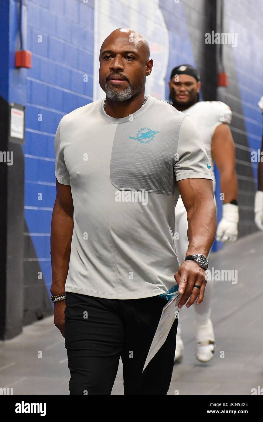Miami Dolphins defensive coordinator Anthony Weaver walks down the ...