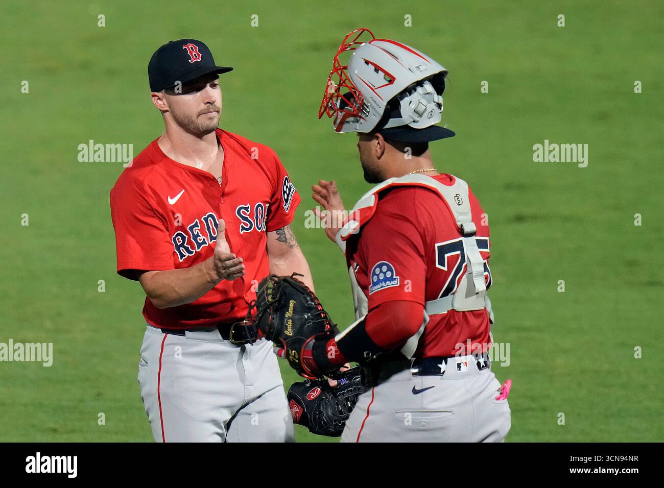 Boston Red Sox pitcher Chris Murphy, left, celebrates with catcher ...