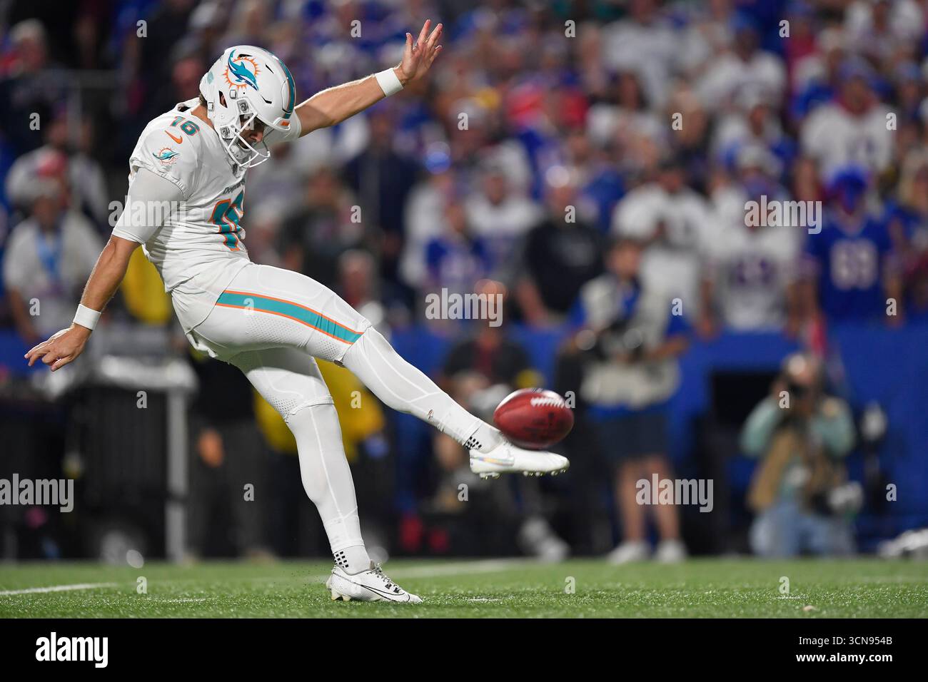 Miami Dolphins punter Jake Bailey (16) kicks during the second half of an NFL football game ...