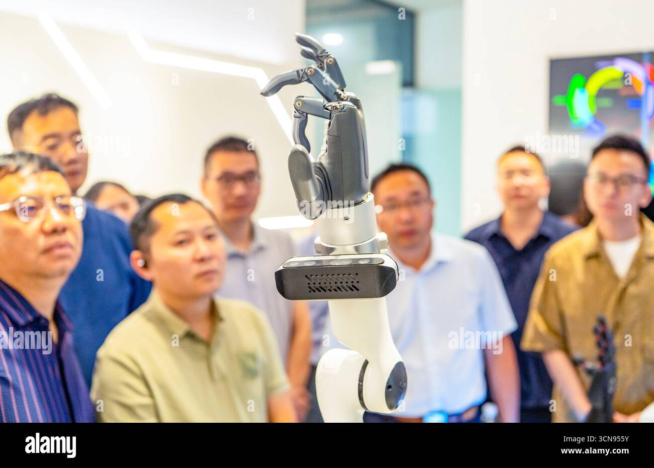 HANGZHOU, CHINA - SEPTEMBER 17, 2025 - Visitors learn about the bionic dexterous hand in the ...