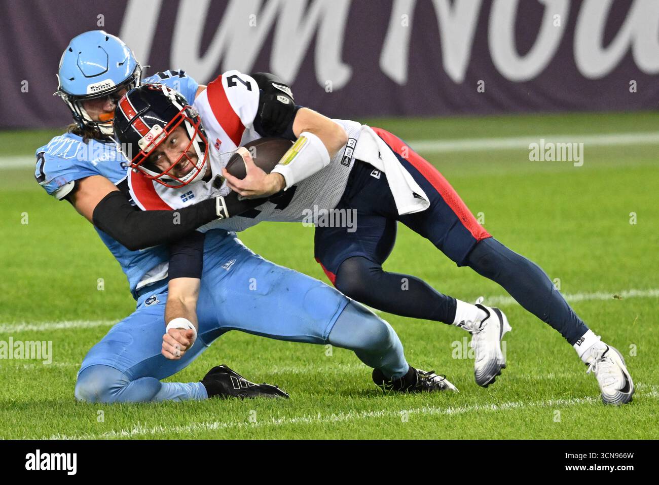 Toronto Argonauts defensive back Derek Slywka (left) tackles Montreal ...